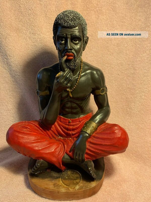 VINTAGE BLACK MAN SMOKING A PIPE STATUE, | #47391709