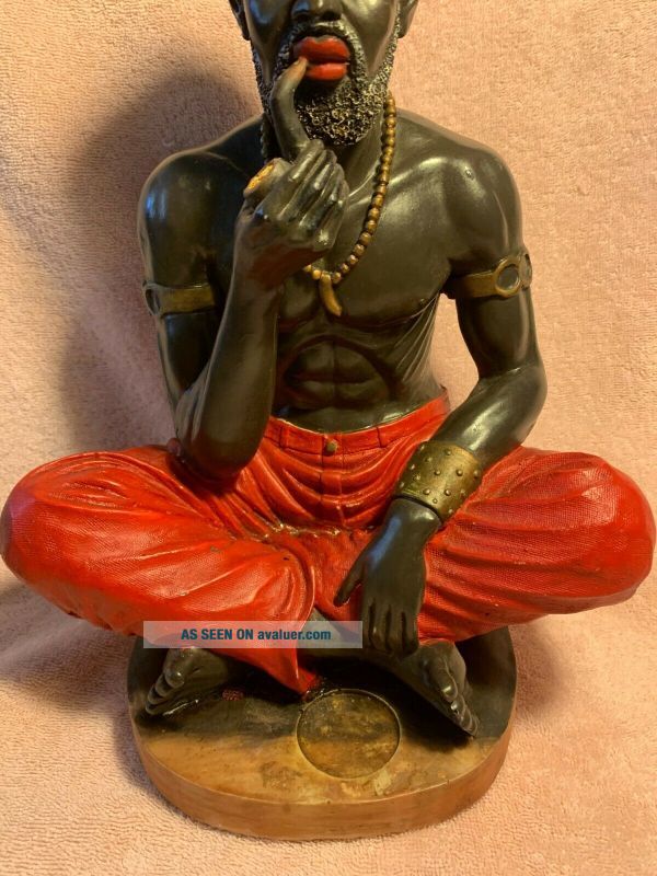 VINTAGE BLACK MAN SMOKING A PIPE STATUE, | #47391709